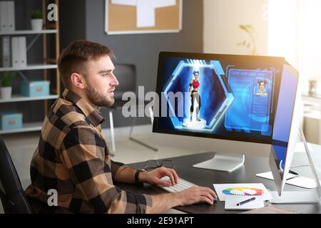 Graphic designer in gaming industry talking detail with his colleague ...