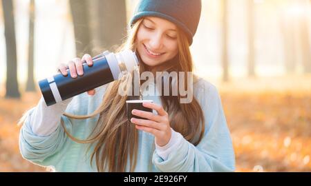 Happy teenager child girl with thermos bottle, hydration, isolated on ...