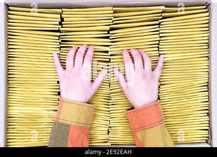 Top view female hands neatly folded white clean towels in case box use ...