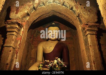 BAGAN, MYANMAR - NOVEMBER 18, 2015: Huge colored statue of Buddha in ...