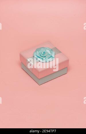 Wrapping blue pastel present box with ribbon on purple background Stock ...