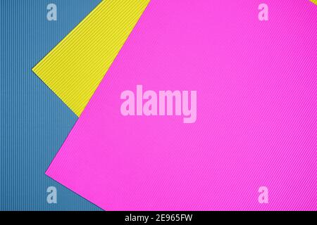 Blue, pink and yellow three tone color paper background with stripes ...
