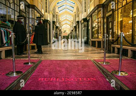 high street retailer security guard standing outside of a shop on guard ...