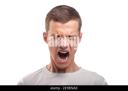 Aggressive young man with gun isolated on white Stock Photo - Alamy