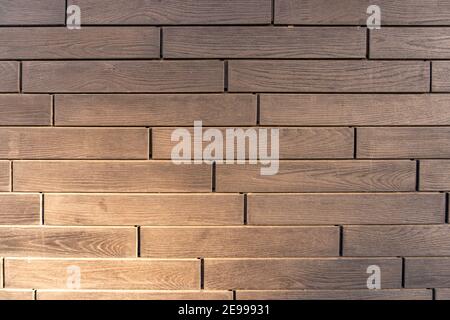 Building cladding with a ventilated facade, wooden texture, brown wood ...