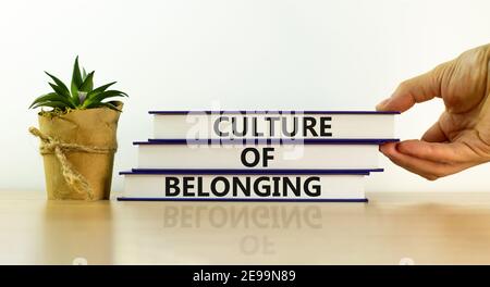Culture of belonging symbol. Books with words 'culture of belonging' on ...