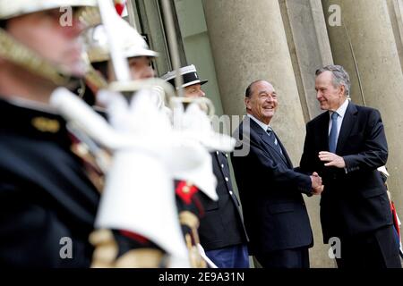 President Jacques Chirac receives former US President George Bush at ...