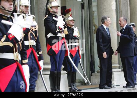 President Jacques Chirac receives former US President George Bush at ...