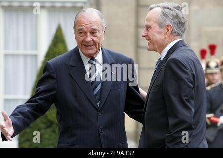 President Jacques Chirac receives former US President George Bush at ...