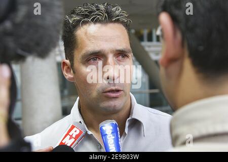Former professional rider Laurent Roux (c) along with his wife Isabelle ...