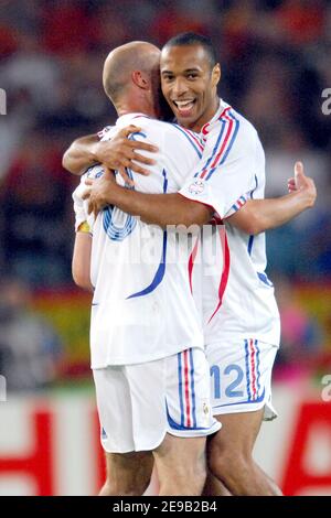 France's Zinedine Zidane and Thierry Henry celebrate the victory during ...