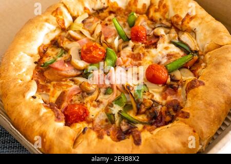 Pizza for one person. Mini pizza in a box. Food delivery Stock Photo ...