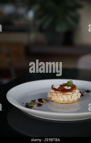 Chocolate dessert cake with berry sauce and almond with decorated Stock ...