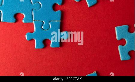 scattered puzzle pieces on colored background Stock Photo - Alamy