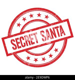 SECRET SANTA word written on red round postal stamp sign Stock Photo ...