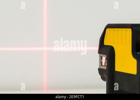 Electronic laser pointing straight lines. Checking angles and setting ...