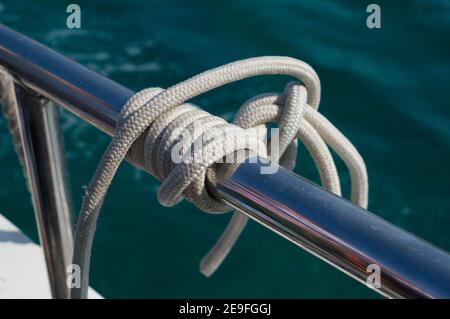 marine knot detail on stainless steel boat railing Stock Photo - Alamy