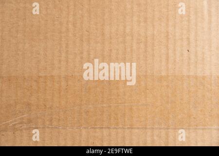 Brown corrugated cardboard texture with wrinkles and creases. Carton ...