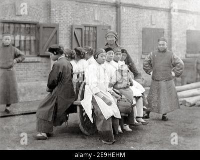 Chinese women on a wheelbarrow, China, circa 1880s Stock Photo - Alamy