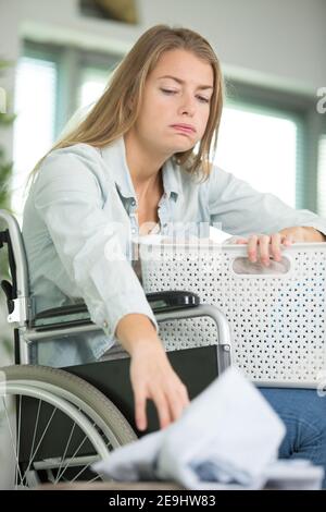 Laundry, frustrated and upset woman in the living room throwing the ...