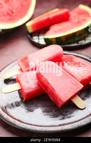 Tray with sweet watermelon sticks on dark background, closeup Stock ...
