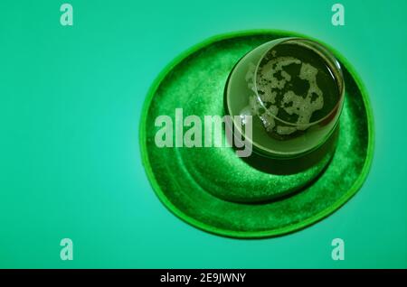 Happy St Patrick's Day concept. Glass of green beer. Party glasses and ...