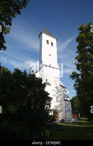 White tower and building of the Harju-Risti Lutheran Church in Estonia ...