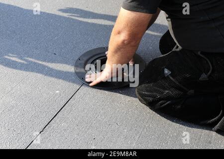 Installation of gradient insulation on a flat roof Stock Photo - Alamy