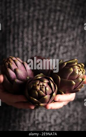 Fresh Artichoke on black background. Raw Artichok closeup Stock Photo ...
