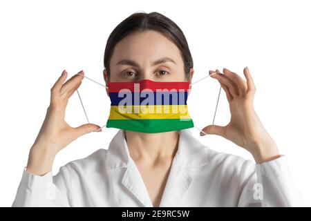 Respirator with flag of Mauritius Doctor puts on medical face mask ...