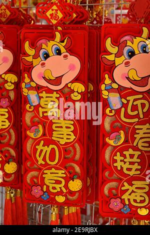 New Year Cow in Golden Decorated with Christmas Garland and Bow on a ...