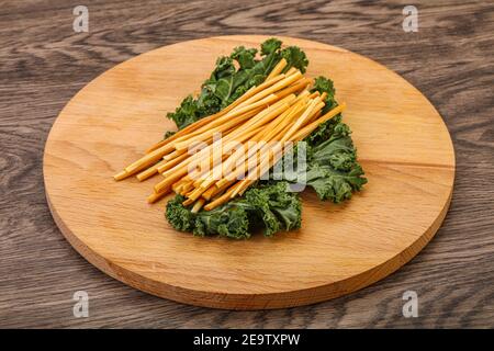 Caucasian Chechel cheese sticks over board Stock Photo - Alamy