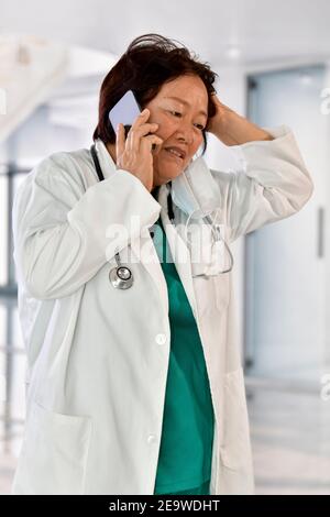 Asian woman doctor using phone tablet medical office healthcare ...