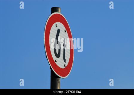 Traffic sign 6t white with red edge in front of blue sky asbackground ...