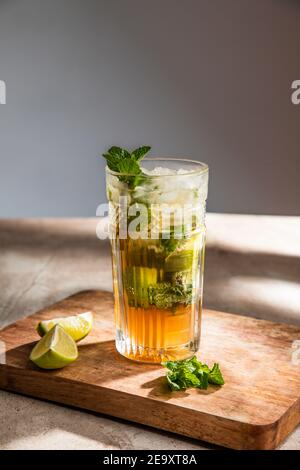 Lime cut to prepare a Mojito cocktail with mint Stock Photo - Alamy