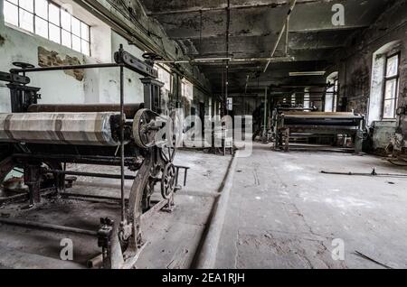 large machine hall in abandoned spinning factory Stock Photo - Alamy
