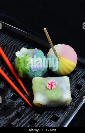 Wagashi, Japanese sweets on tray with characters and gift pack Stock ...
