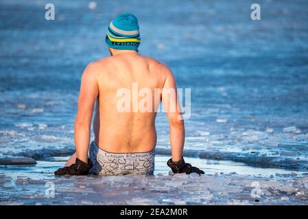 Zegrze, Poland - February 6, 2021: Piercing. A man walking into the ...