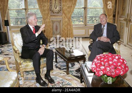 President Jacques Chirac receives former US President George Bush at ...