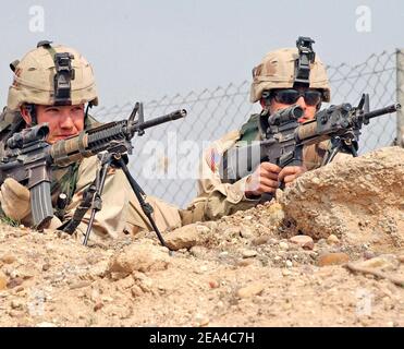 U.S. Army and Iraqi police personnel meet prior to a joint sports day ...