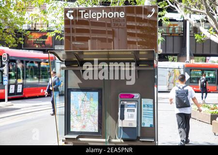 Traditional Telstra public phone booth payphone using landline ...