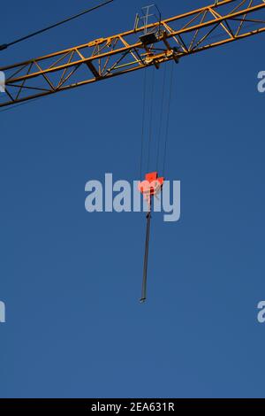 Building crane boom with steel hook Stock Photo - Alamy