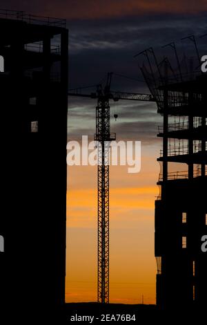 Sunrise between buildings Stock Photo - Alamy