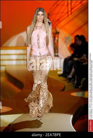 A model wears a creation as part of Versace Fall/Winter 2020/2021 ...