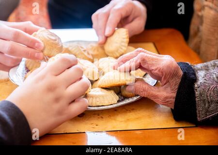 Arabic family eating sweets together and drinking coffee Stock Photo ...