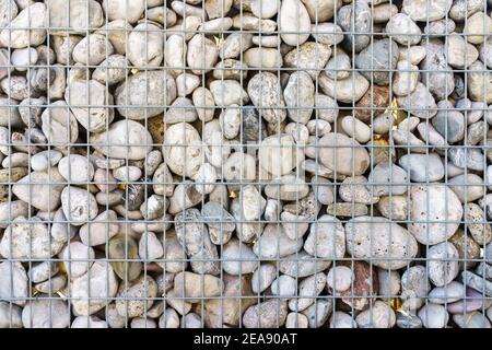 Texture background stones under the metal grid. Natural pattern 2 Stock ...