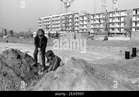 1980s, on a housing construction site, a site foreman in a donkey ...