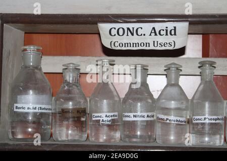 transparent bottles filled with concentrated acid Stock Photo - Alamy