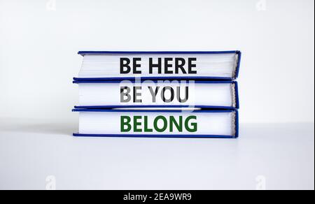 Belong symbol. Books with words 'be here, be you, belong' on beautiful ...