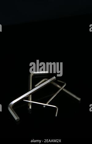 Allen keys with plain black background Stock Photo - Alamy